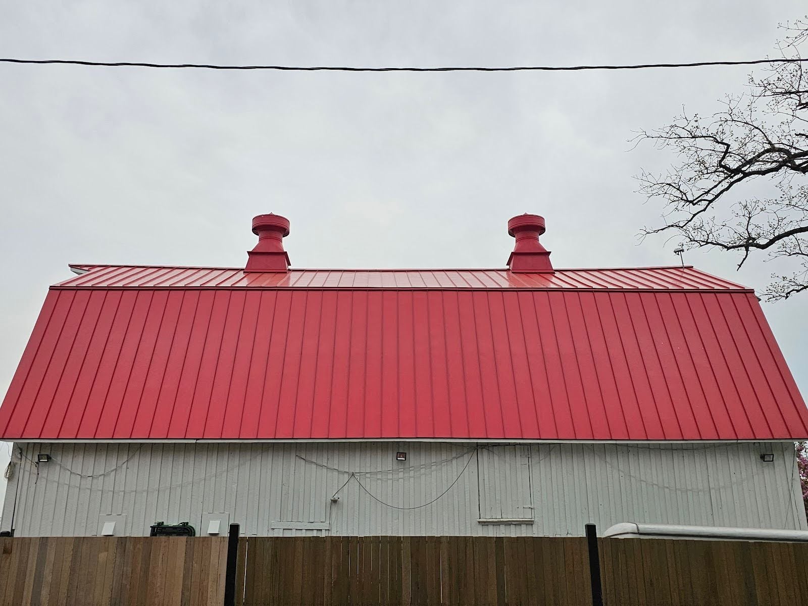 Striking Seam Red Roof on Gambrel Design